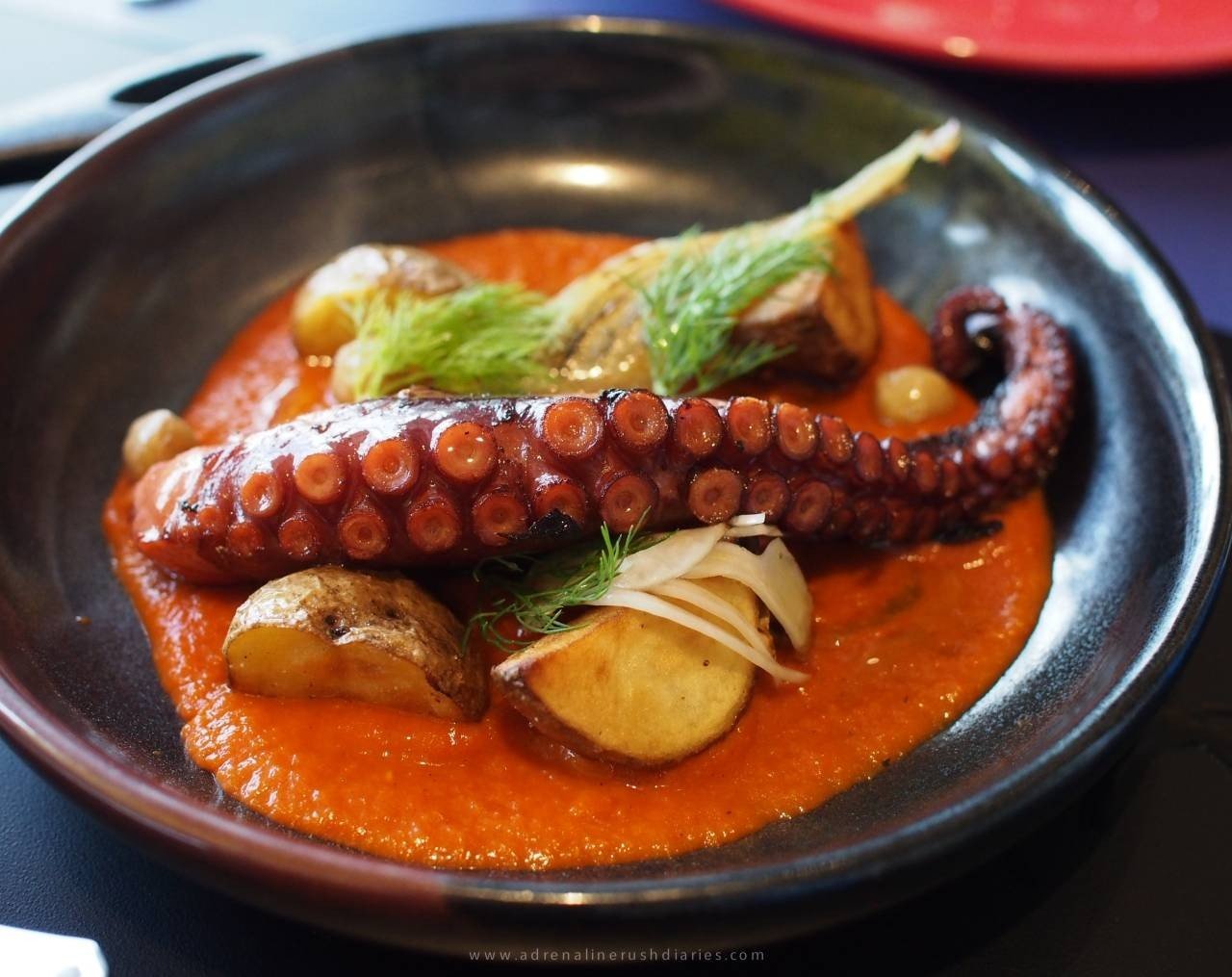 Charred octopus, funnel, fingerling potato, chickpeas, piquillo peppers ...